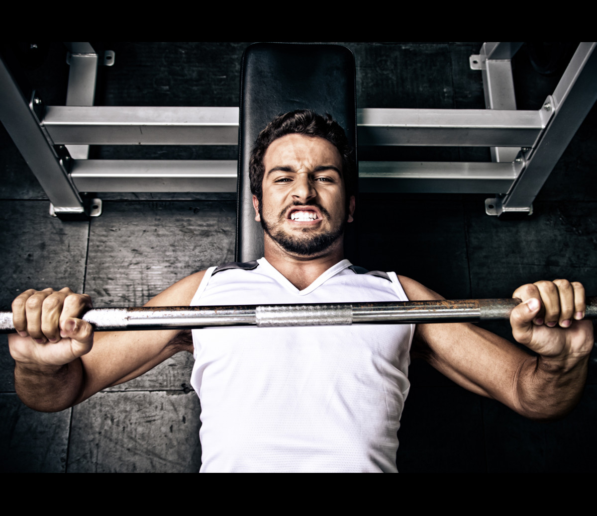 Here's How to Improve Your Bench Press With Your Back - Men's Fitness