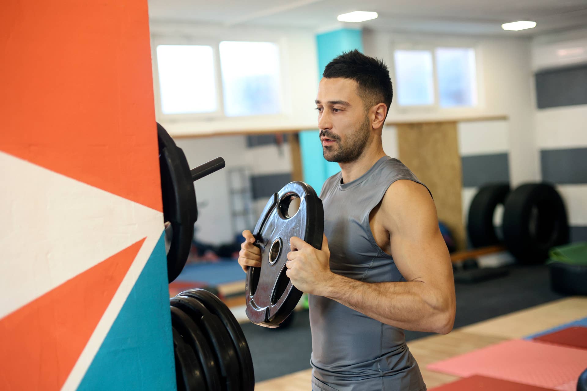 The Surprisingly Hard 45-Pound Plate Workout Is a Perfect Strength Time ...