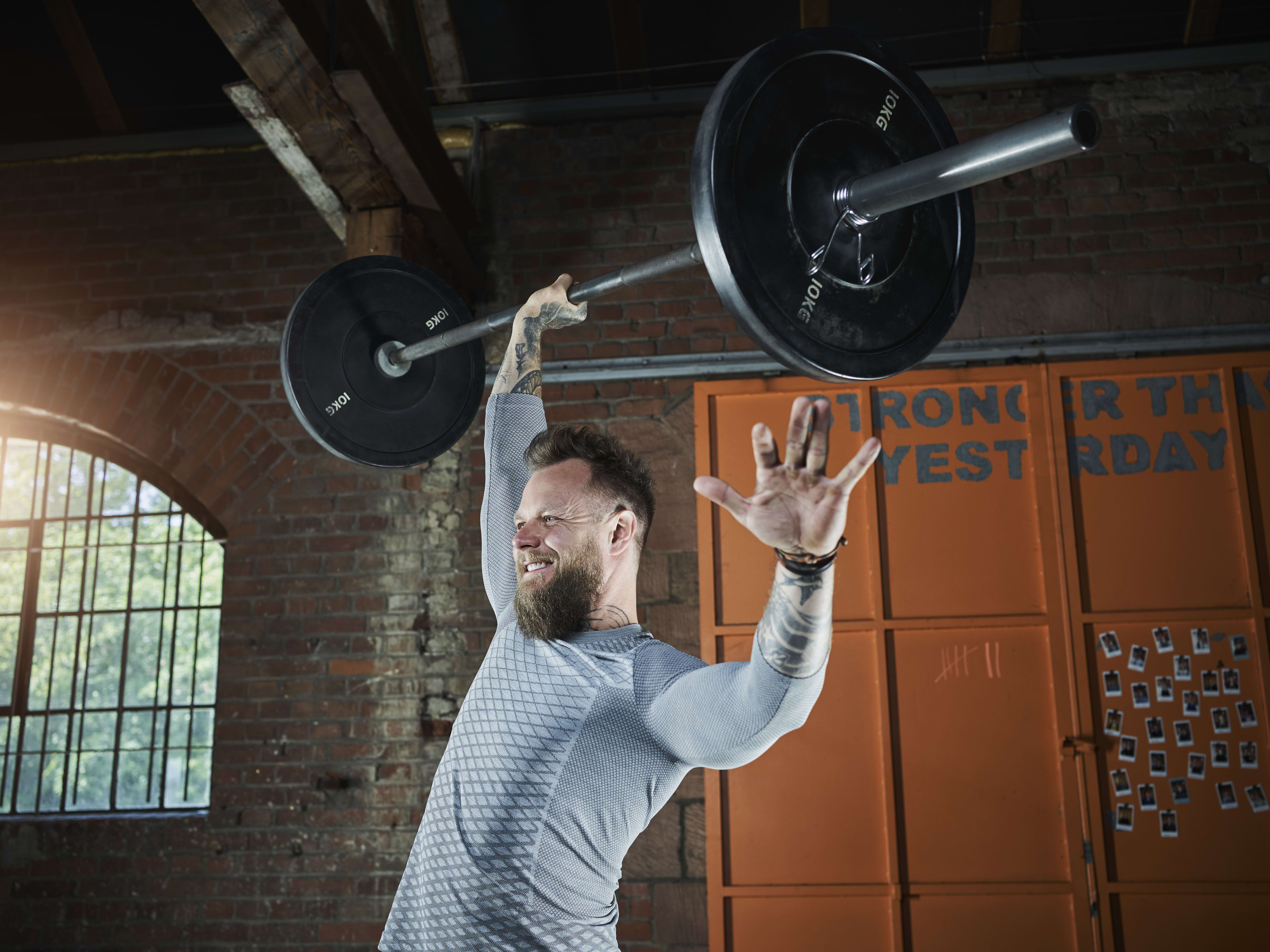 Strongman Move: How to Do a Single-Arm Barbell Press - Men's Fitness
